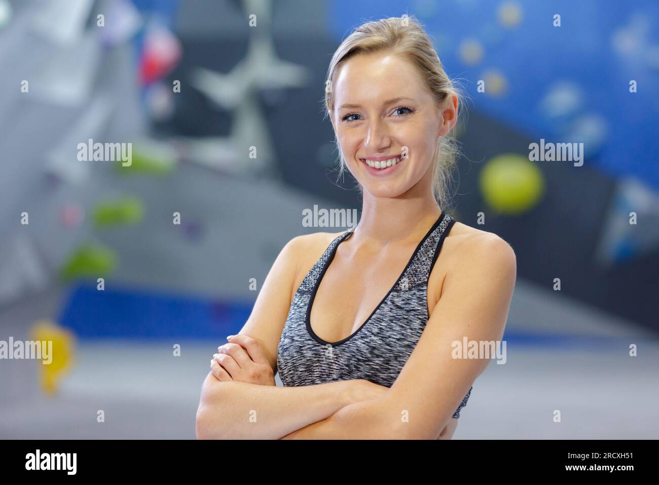 a happy female wall climber posing Stock Photo - Alamy