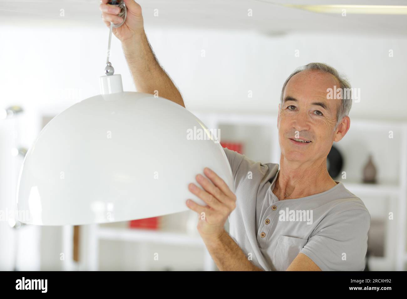 installing a lamp at home Stock Photo - Alamy