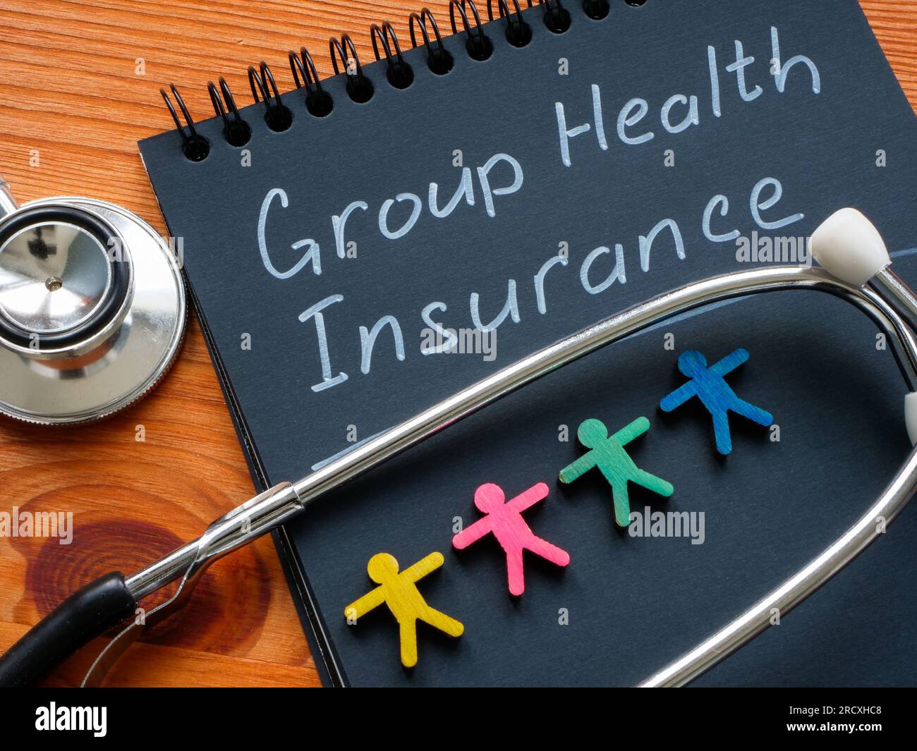 Group Health insurance sign near figurines and stethoscope Stock Photo ...