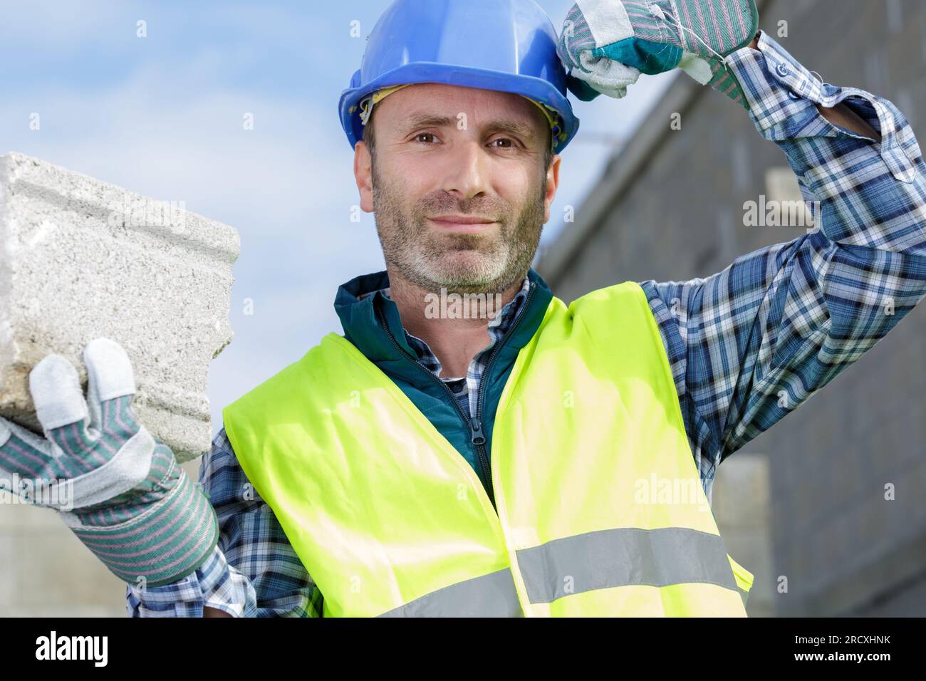 a confused man builder outdoors Stock Photo - Alamy