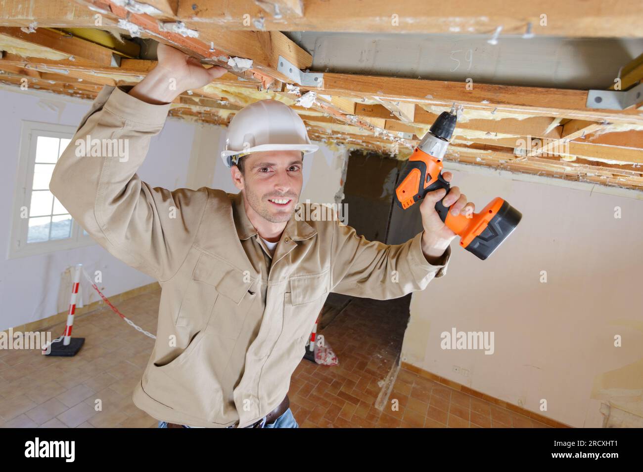 construction worker wear safety uniform installation ceiling work Stock ...