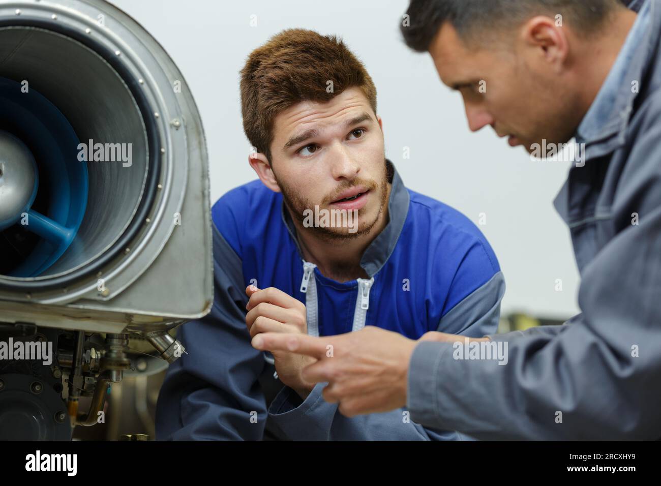 Engineer talking male apprentice hi-res stock photography and images ...