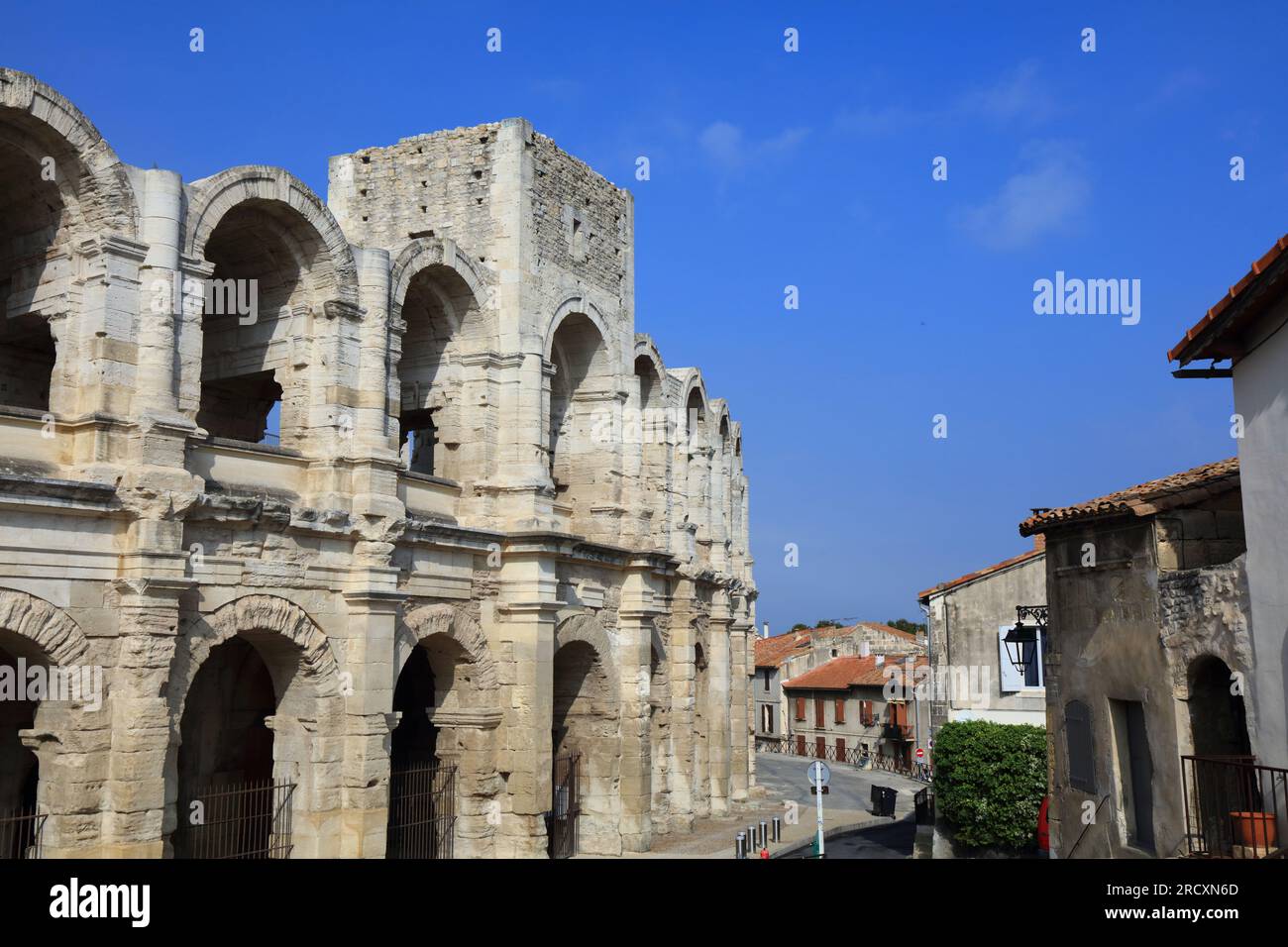 Arles town in Provence, France. UNESCO world heritage site - ancient Roman amphitheatre ruins ...