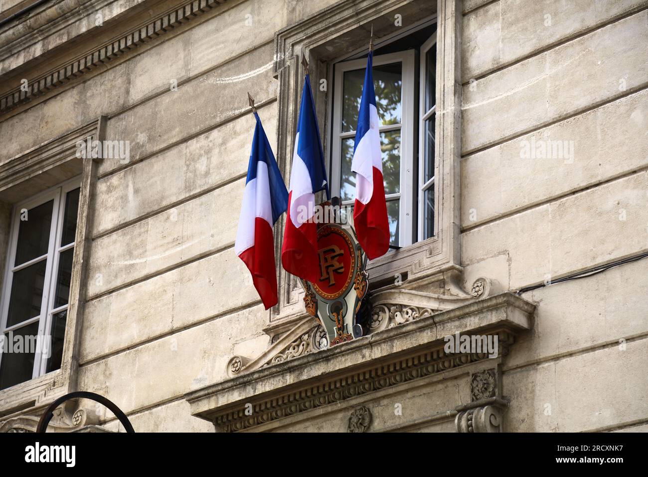 Avignon town hall (Hotel de Ville) in France. French flag in local ...