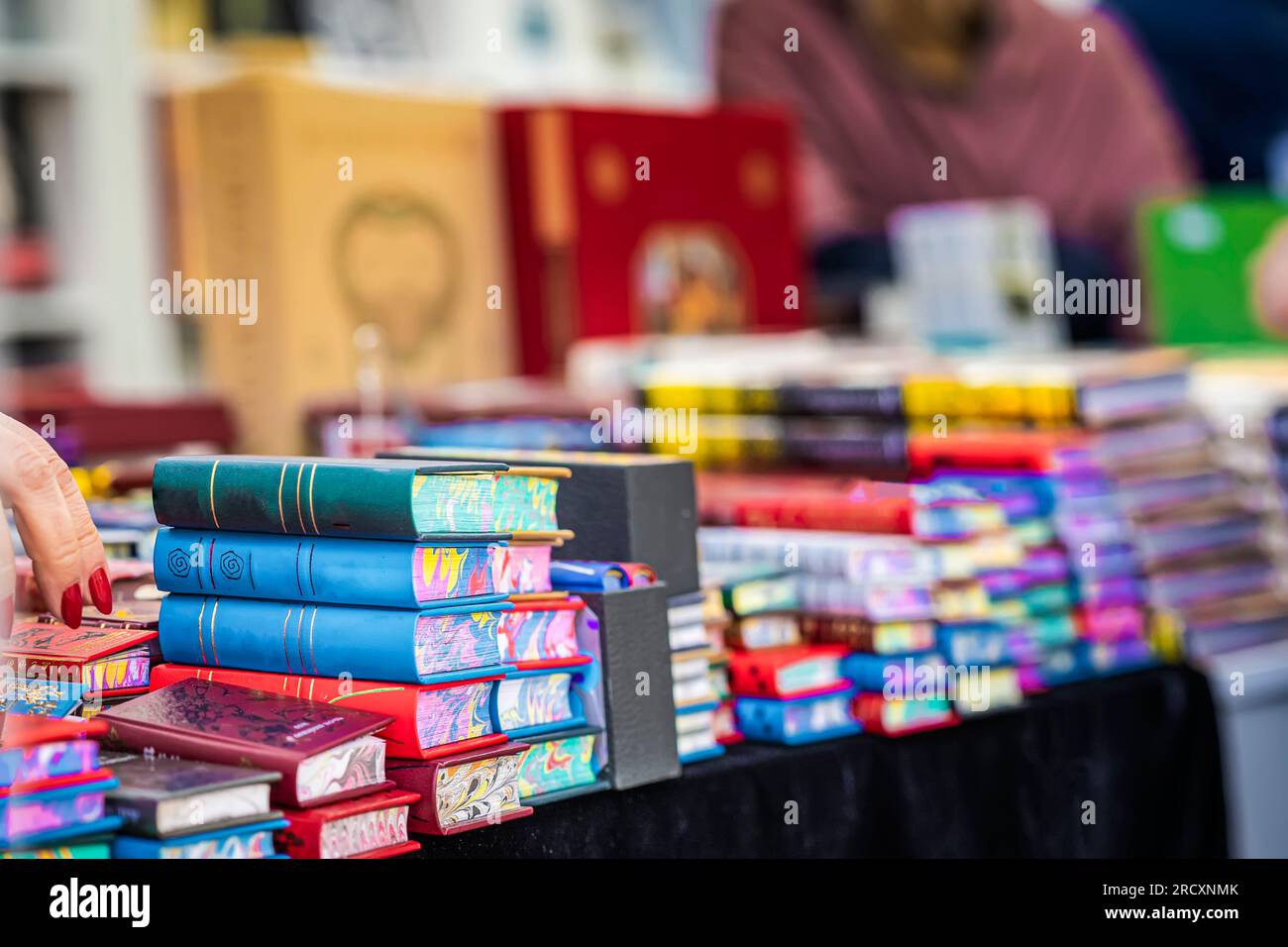 Abstract blurred background of pile books, textbooks, fiction in book ...