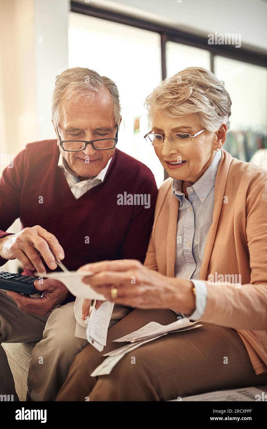 Senior couple, finance and bills in budget check for expenses, receipts or calculating costs at ...
