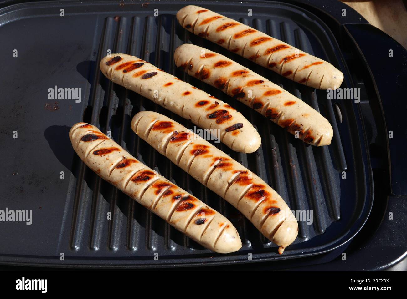 German food. Thuringian white sausage on a barbecue. Thuringia region ...