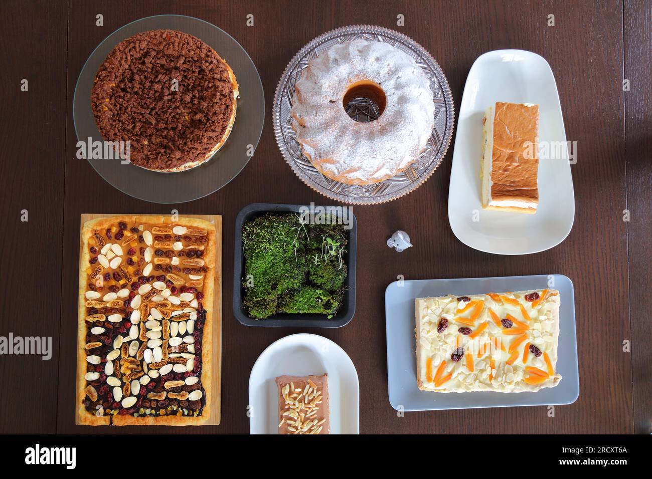 Easter cakes table in Poland. Easter pastry: babka cake, mazurek cakes ...