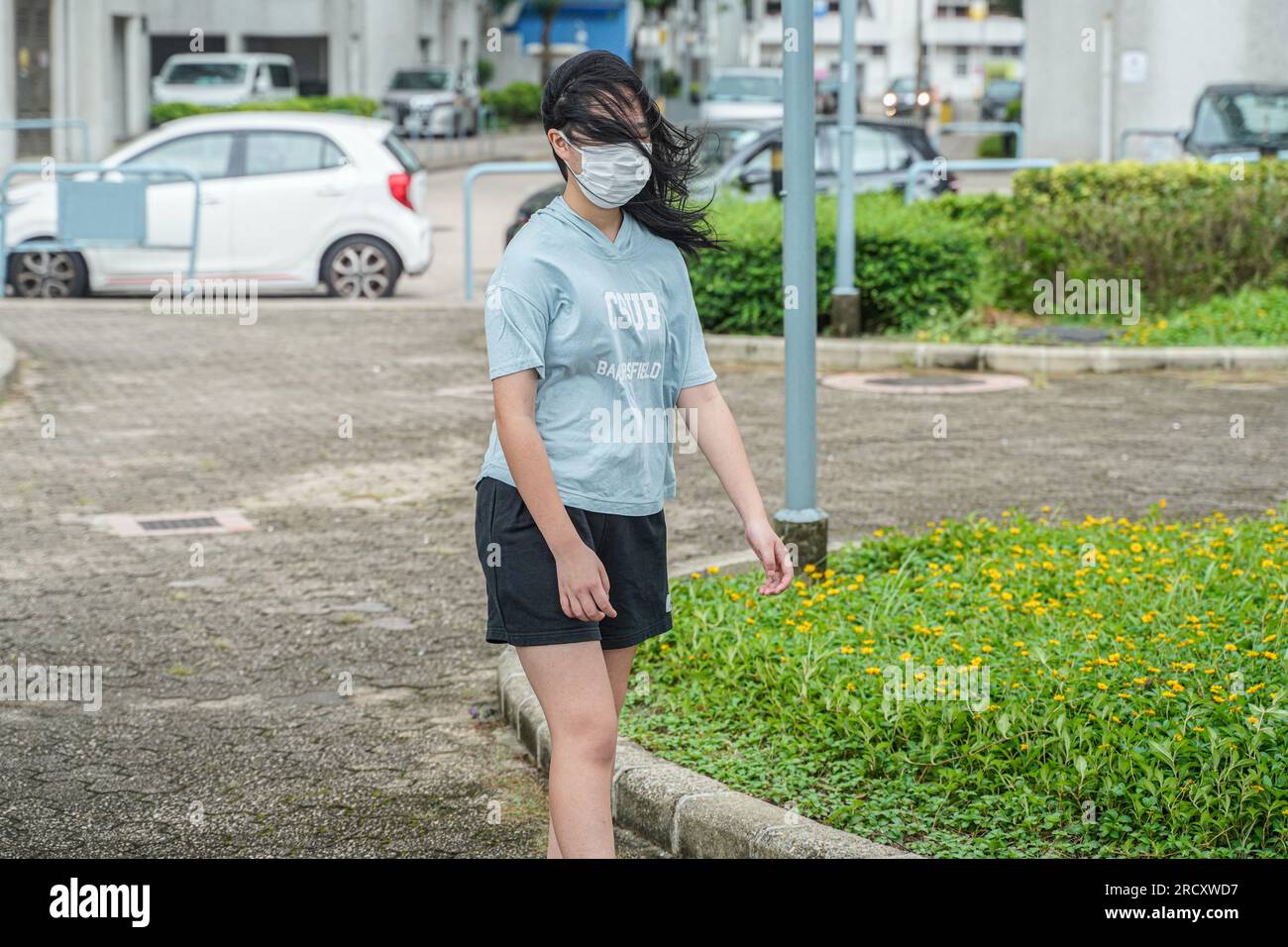 Hong Kong. 17th July, 2023. A woman walks at Heng Fa Chuen harbour ...