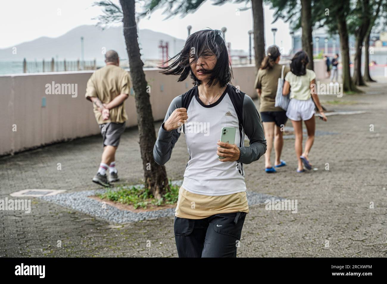 Hong Kong. 17th July, 2023. A woman walks at Heng Fa Chuen harbour ...