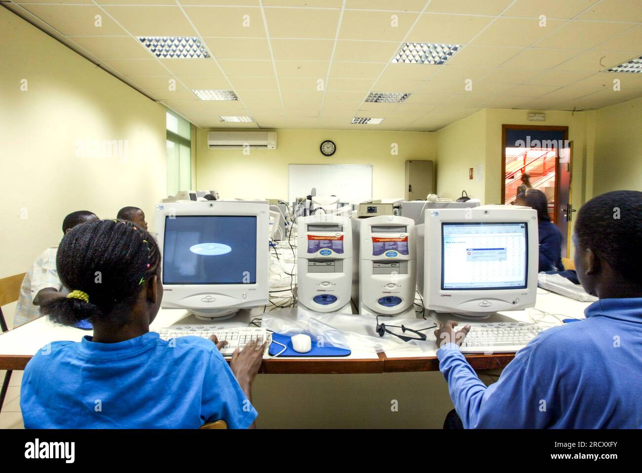 High school students doing practical work in the computer room at the ...