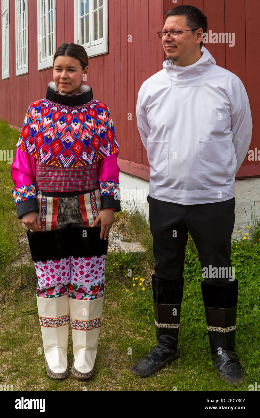 Inuit girl wearing national costume standing with man outside church at ...