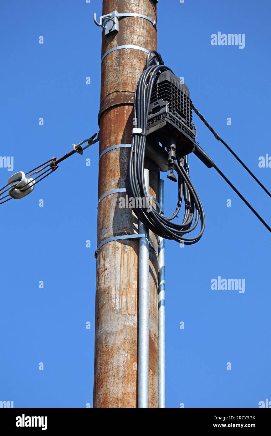 Internet router on a pole outdoor with cables Stock Photo - Alamy