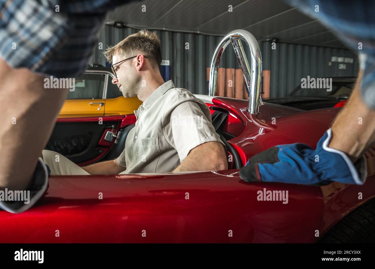 Caucasian Vehicle Owner Testing His Classic Muscle Car While His Car ...