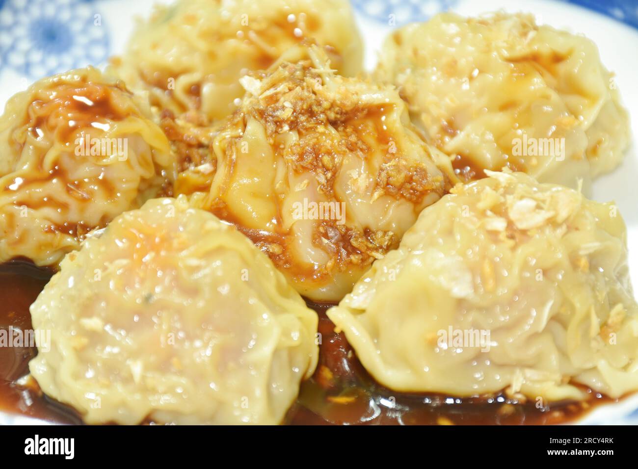 steamed Chinese dumpling filling mashed pork and shrimp topping crispy ...