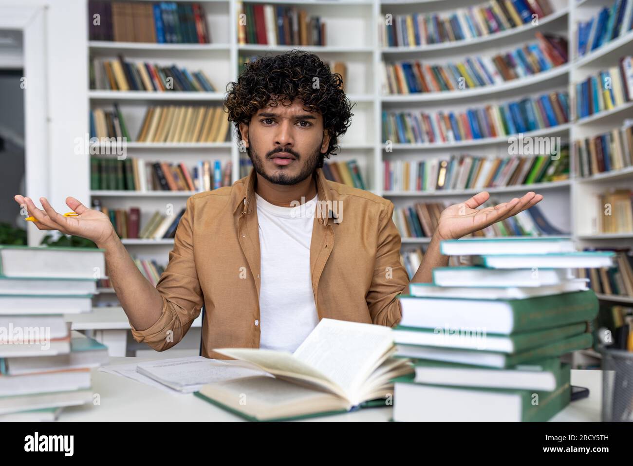 Dissatisfied and frustrated student trying to concentrate and prepare ...