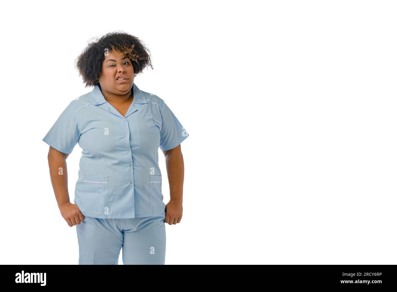 young venezuelan afro-latin nurse woman, in blue uniform standing ...