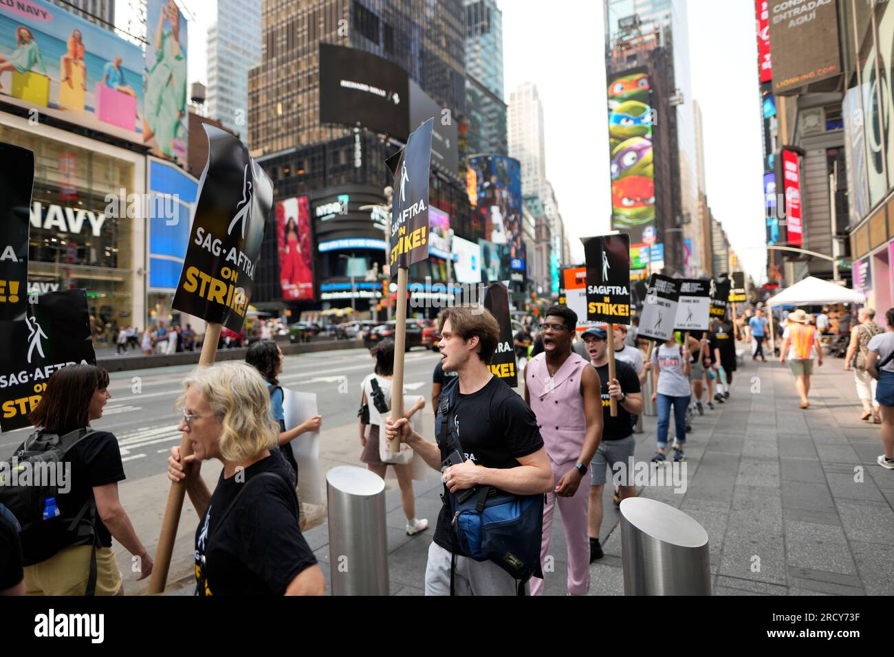 Picketers carry signs outside Paramount in Times Square on Monday, July ...