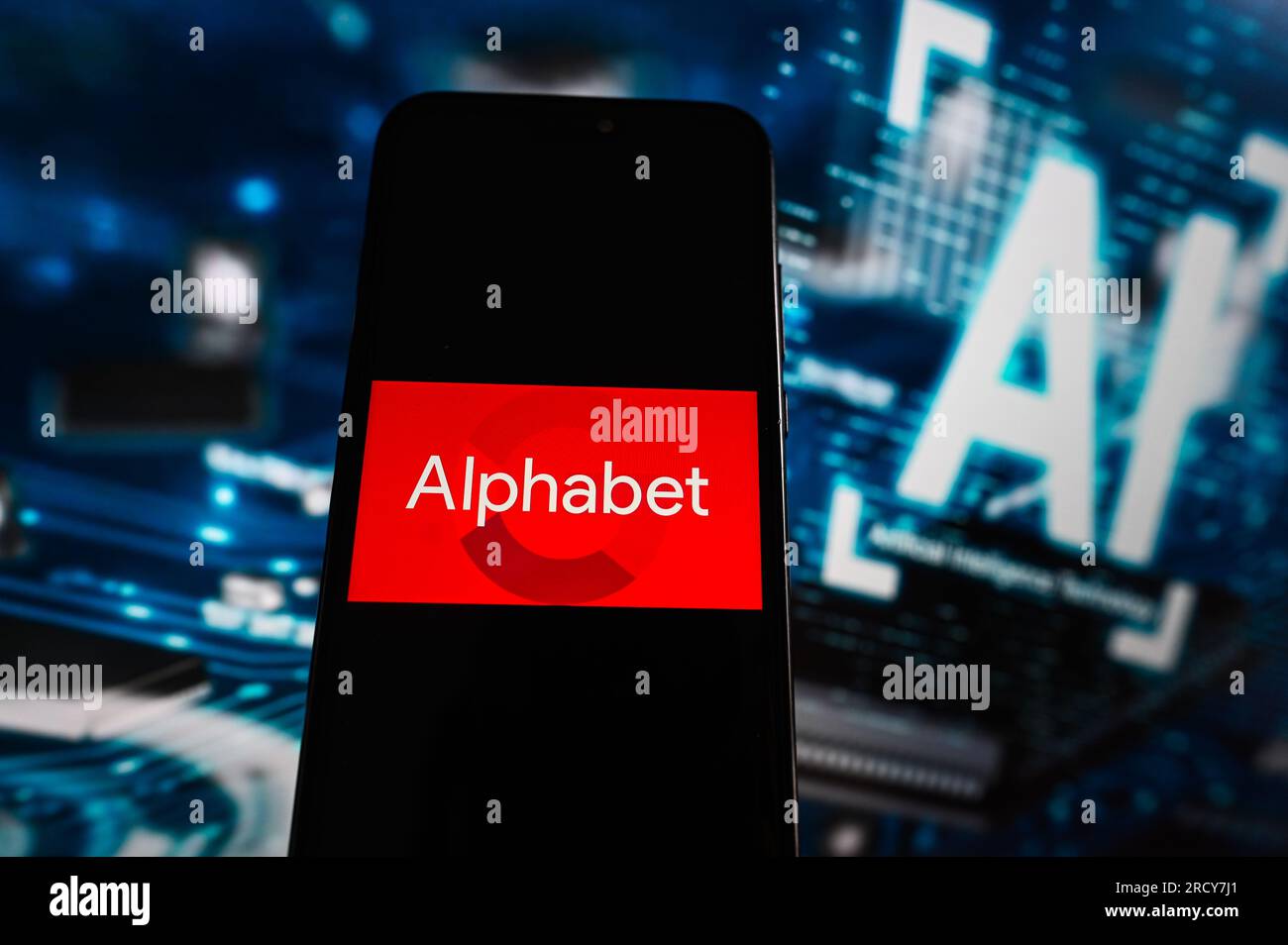 In this photo illustration a Google Alphabet logo is displayed on a ...
