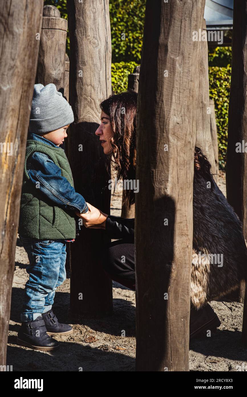 Calm mom talking to her attentive child. Conversation between mother ...