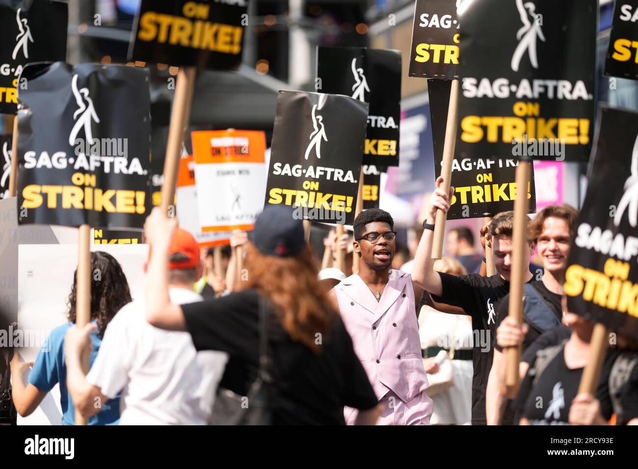 Picketers carry signs outside Paramount in Times Square on Monday, July ...