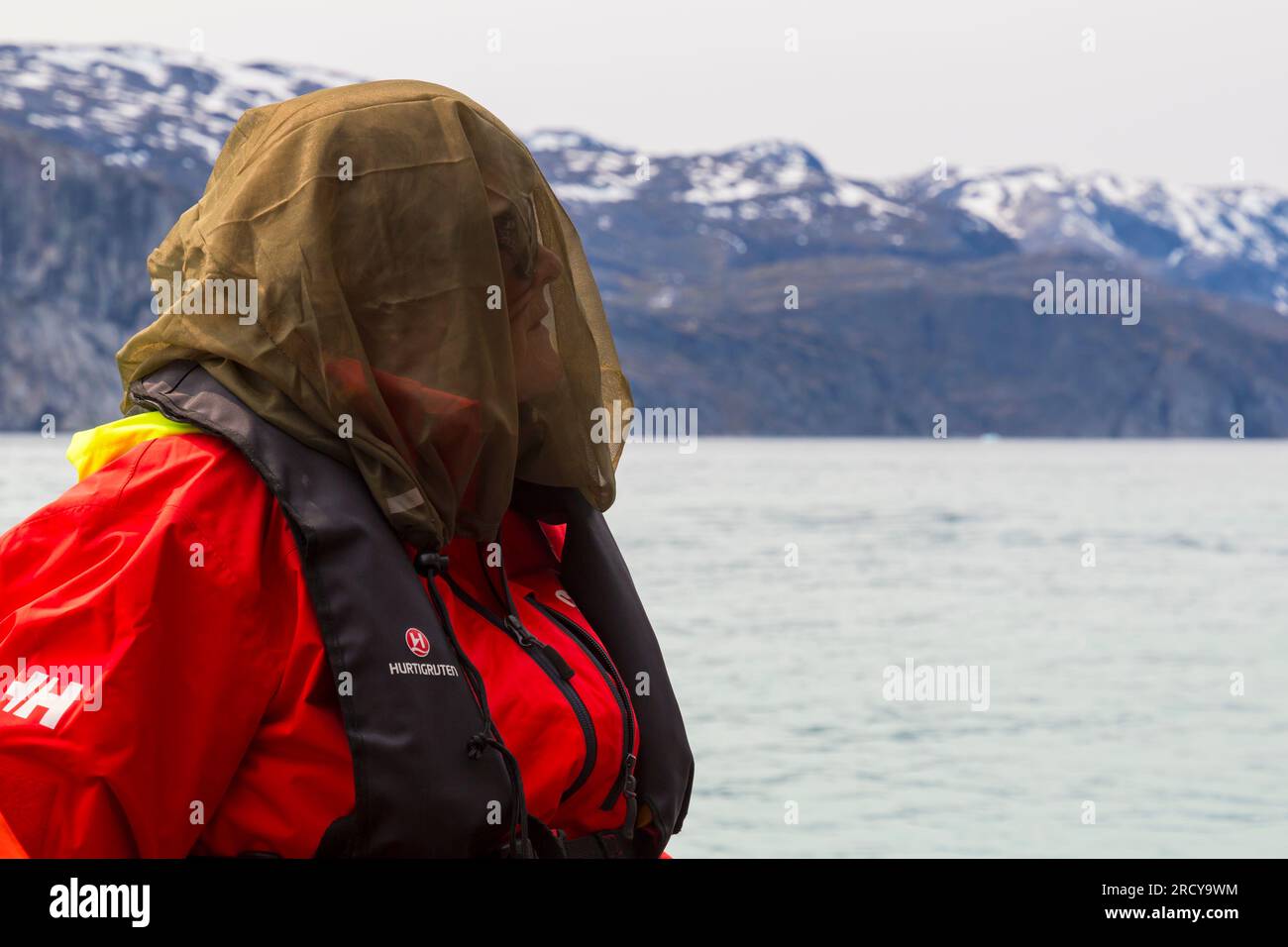 woman wearing mosquito net for protection against the mosquitos insects ...