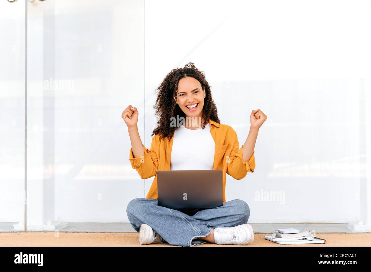 Joyful successful brazilian or hispanic female student, sit on the ...