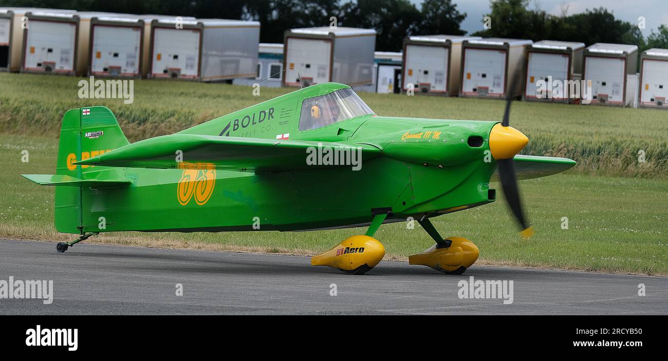 High wing light aircraft flying from provincial grass airfield Stock ...