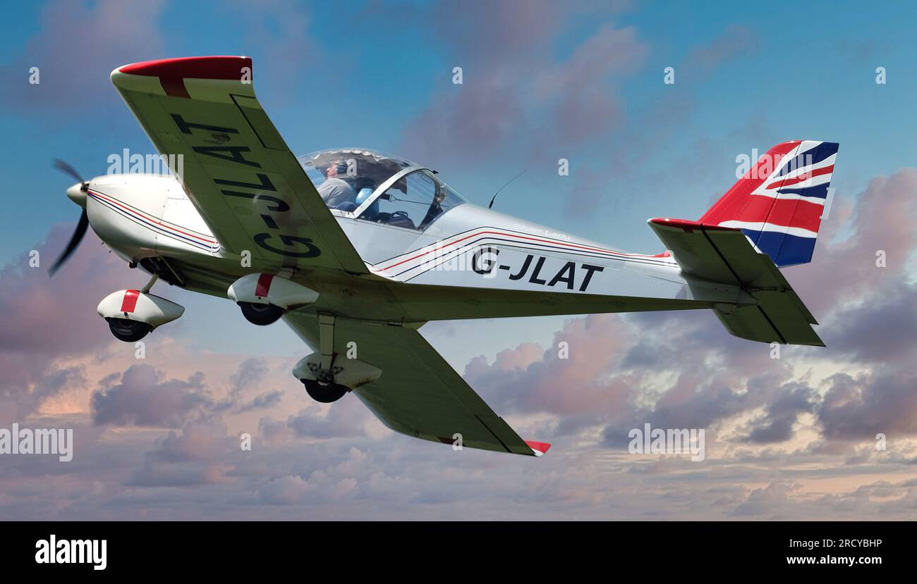 Low wing light monoplane in flight over local urban airfield Stock ...