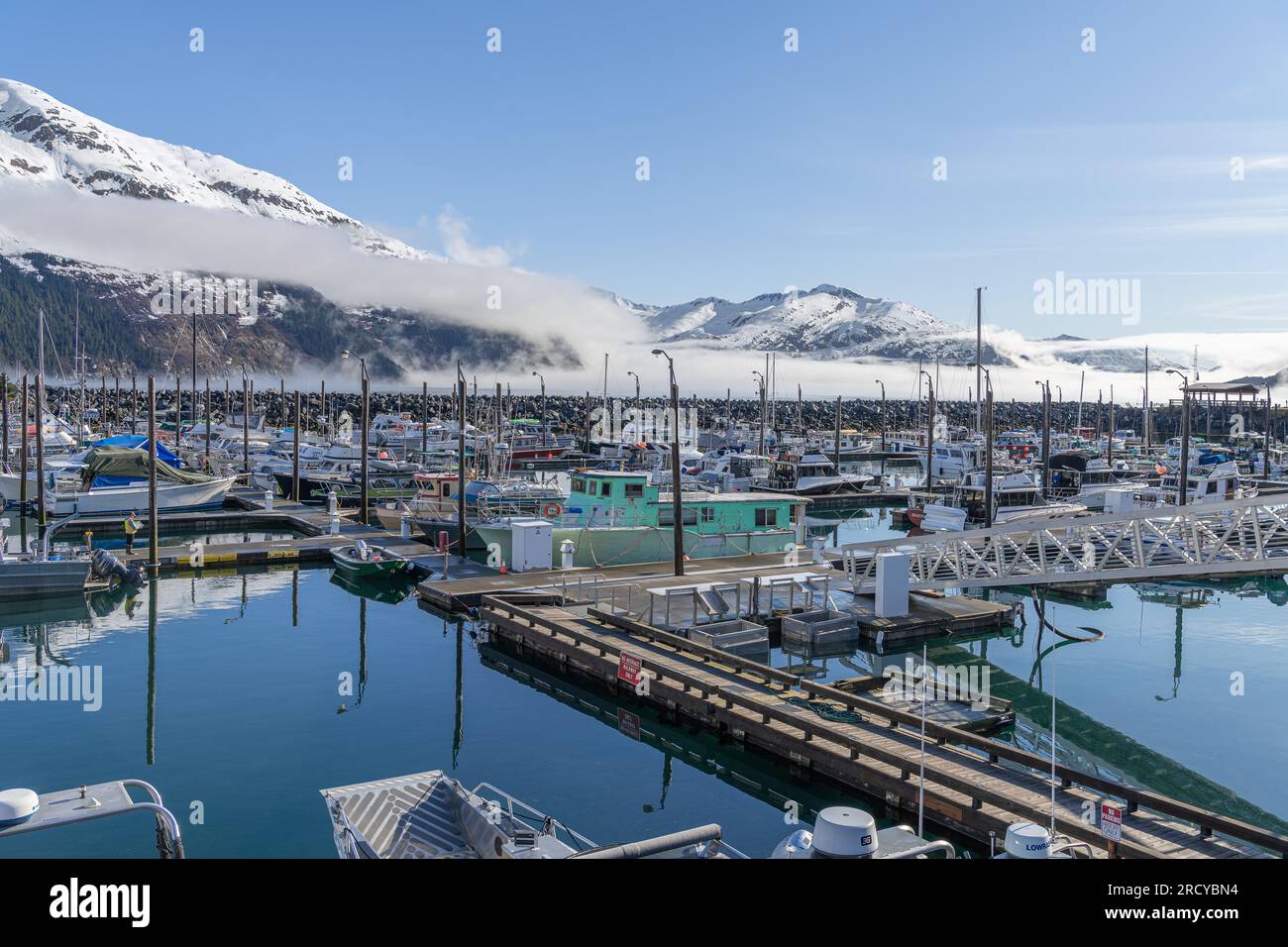 Pleasure and Fishing boats in Whittier marina with clouds and mist ...