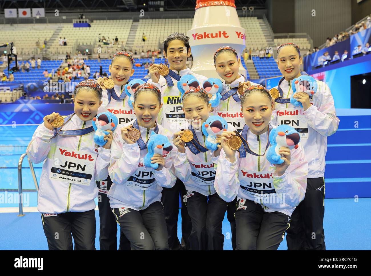 Japan team poses with their bronze medals after competing in the team ...