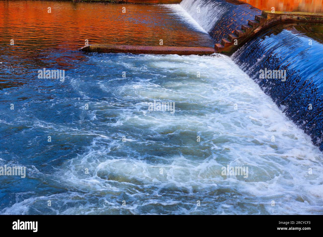 Water flow from the dam to the river . Water cascade flowing Stock ...