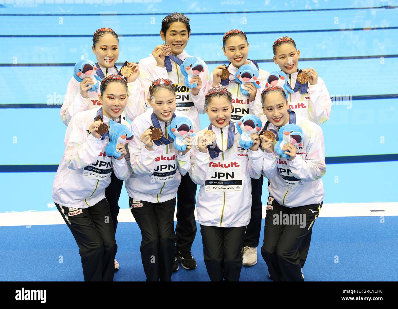 Japan team poses with their bronze medals after competing in the team ...