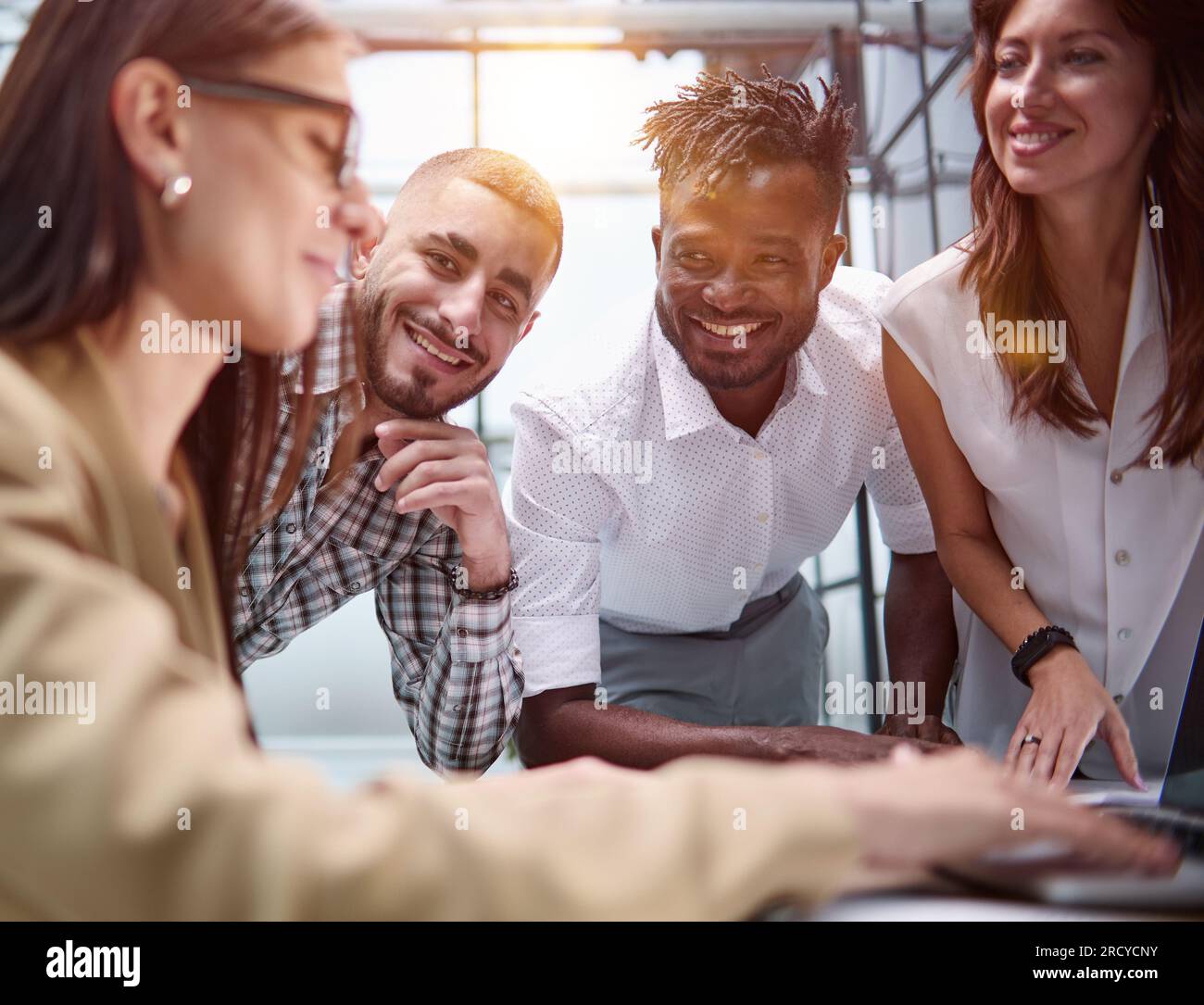 Colleagues lean on the conference table and discuss business, app UI ...