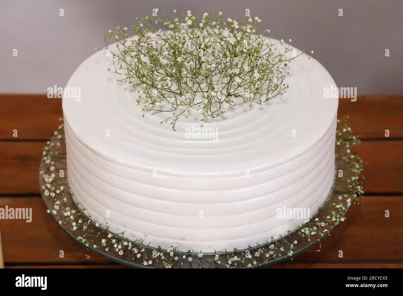 white chocolate cake with chocolate shavings on baptism table ...