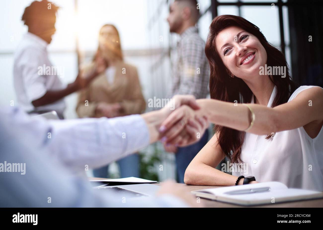 Young speaker interviewing new partners in the office Stock Photo - Alamy