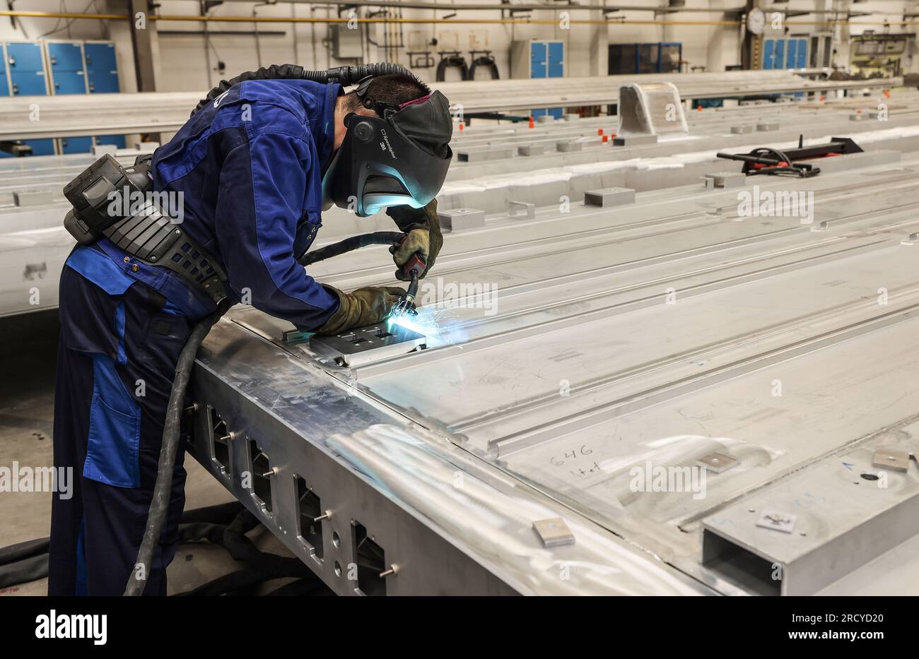Krefeld, Germany. 17th July, 2023. A Siemens employee welds a component ...