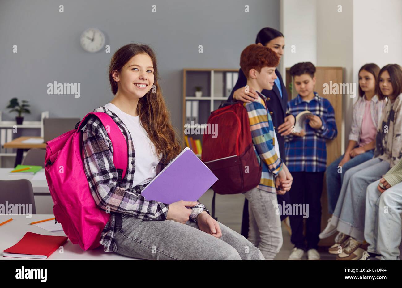 Smiling junior high girl student in classroom hi-res stock photography ...