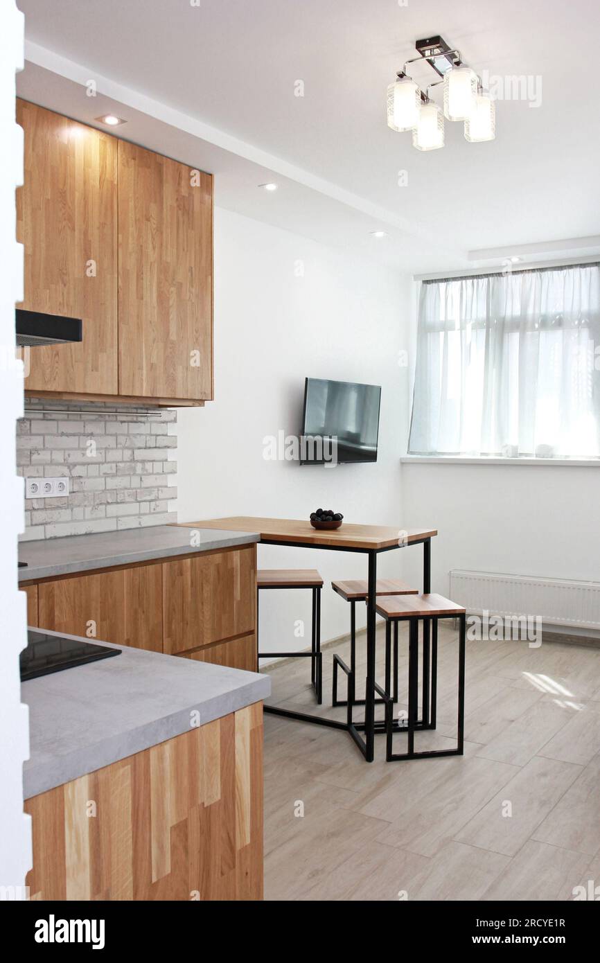 interior of the kitchen in Scandinavian motifs, oak furniture with a ...