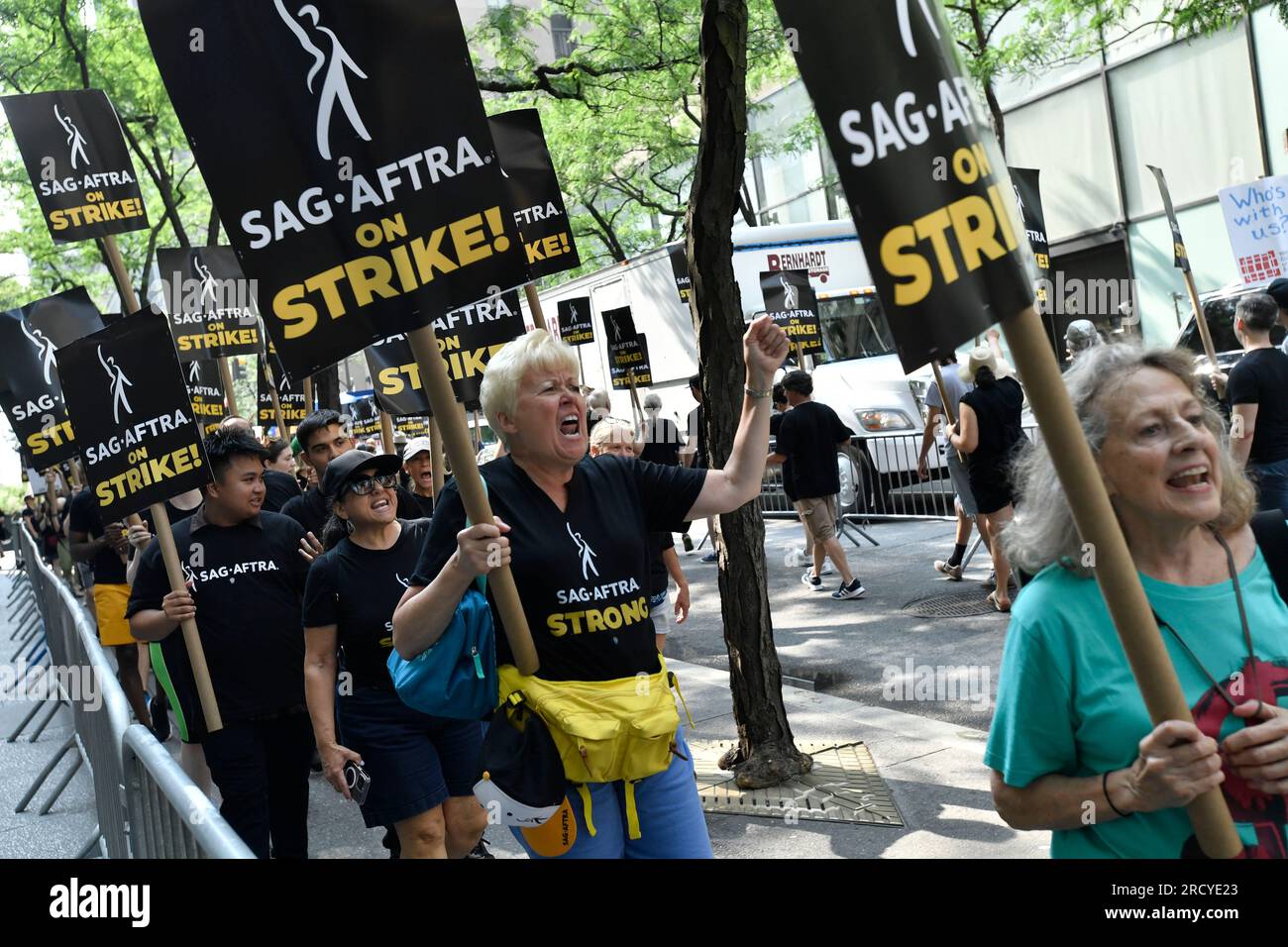 Picketers carry signs outside NBC in Rockefeller Center on Monday, July ...
