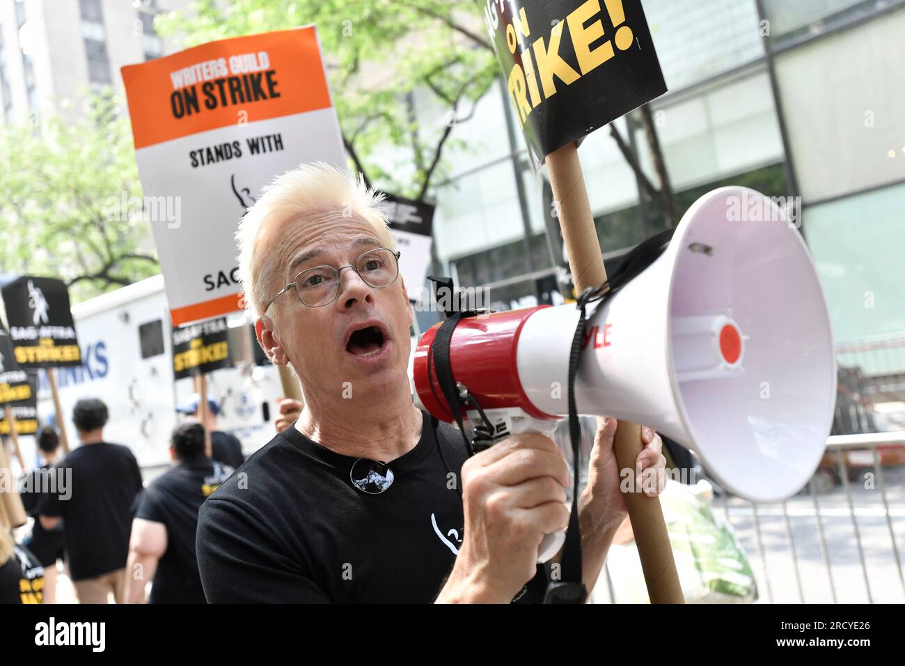 Picketers carry signs outside NBC in Rockefeller Center on Monday, July ...