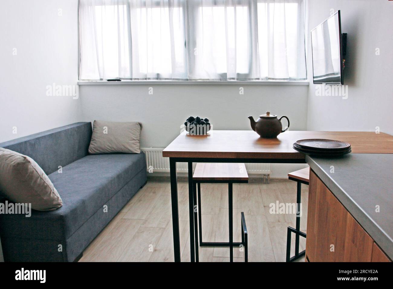 Scandinavian-style kitchen interior with oak furniture with a clay ...