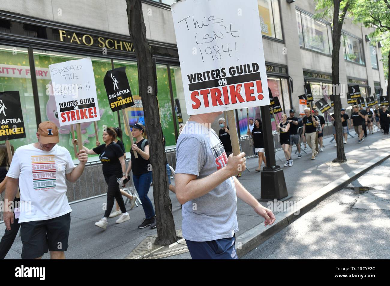 Picketers carry signs outside NBC in Rockefeller Center on Monday, July ...