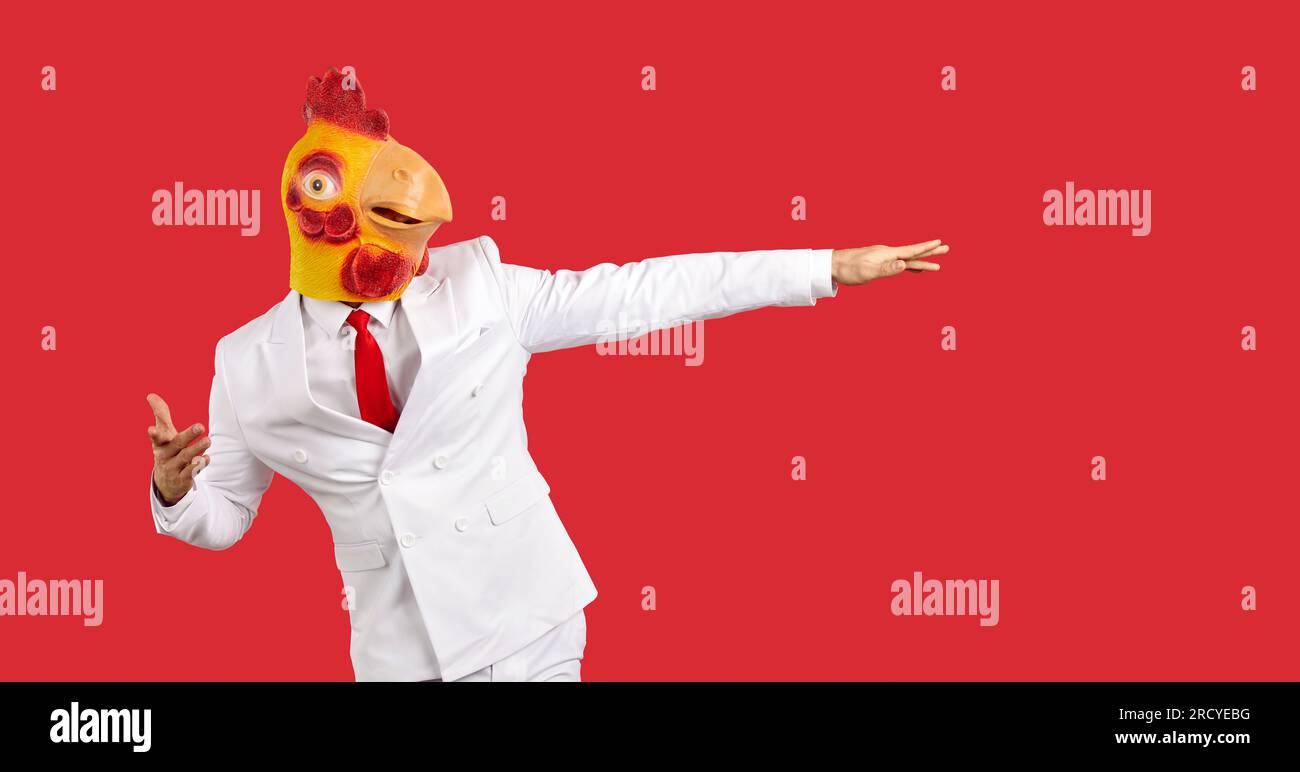 Funny humorus man in rubber mask rooster having fun dancing isolated on ...