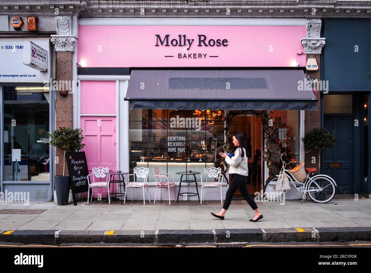 London, UK, Nov 2022, view of a woman passing by Molly Rose, a bakery ...