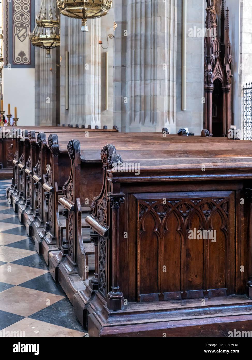 Church aisle with rows of ornamental wooden pews Stock Photo - Alamy