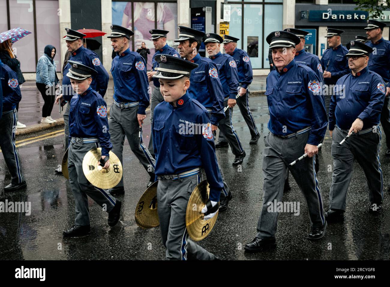 Members of the Partick Protestant Boys Band of Glasgow march through ...