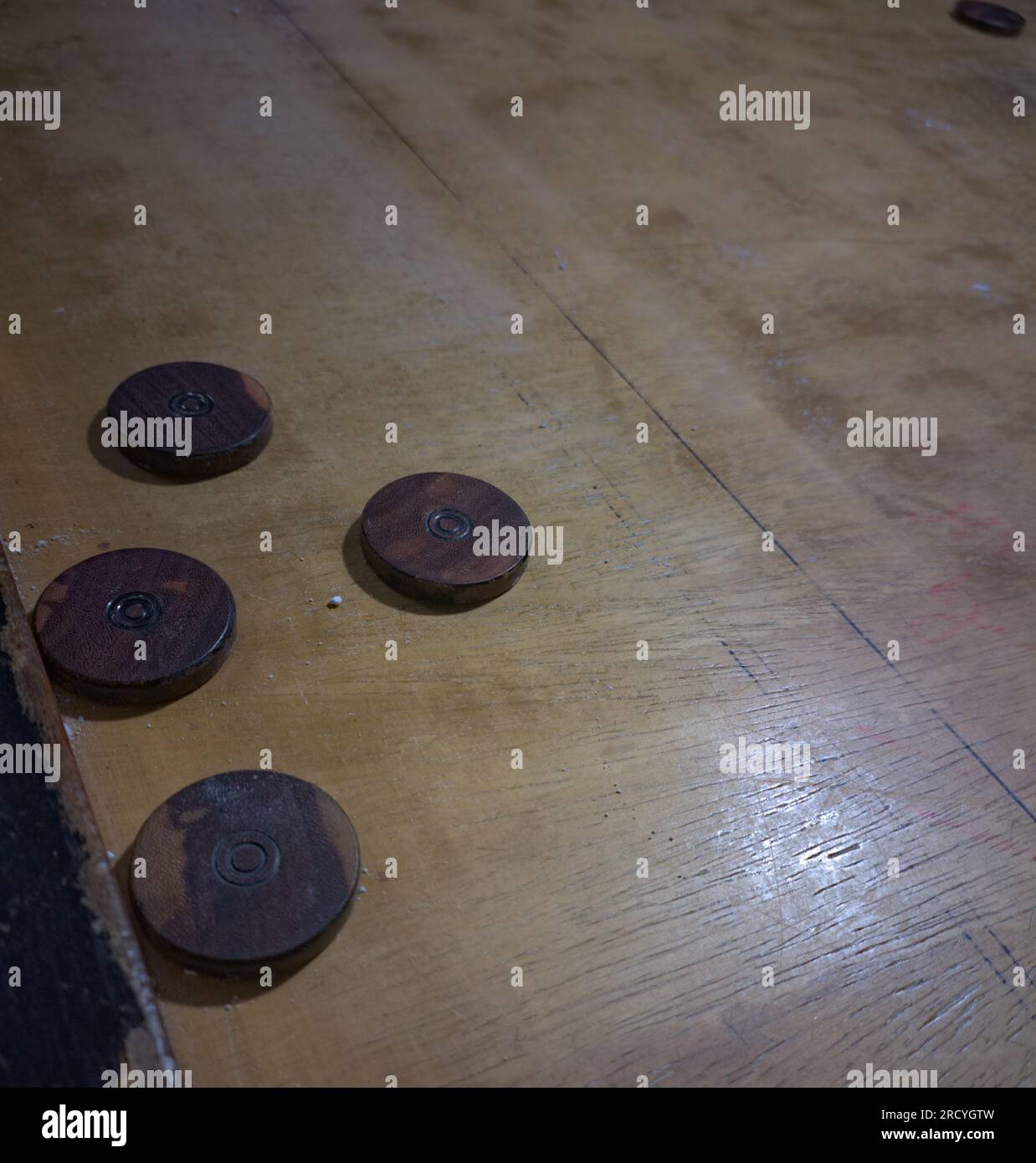wooden carrom pieces lying on polished board Stock Photo - Alamy
