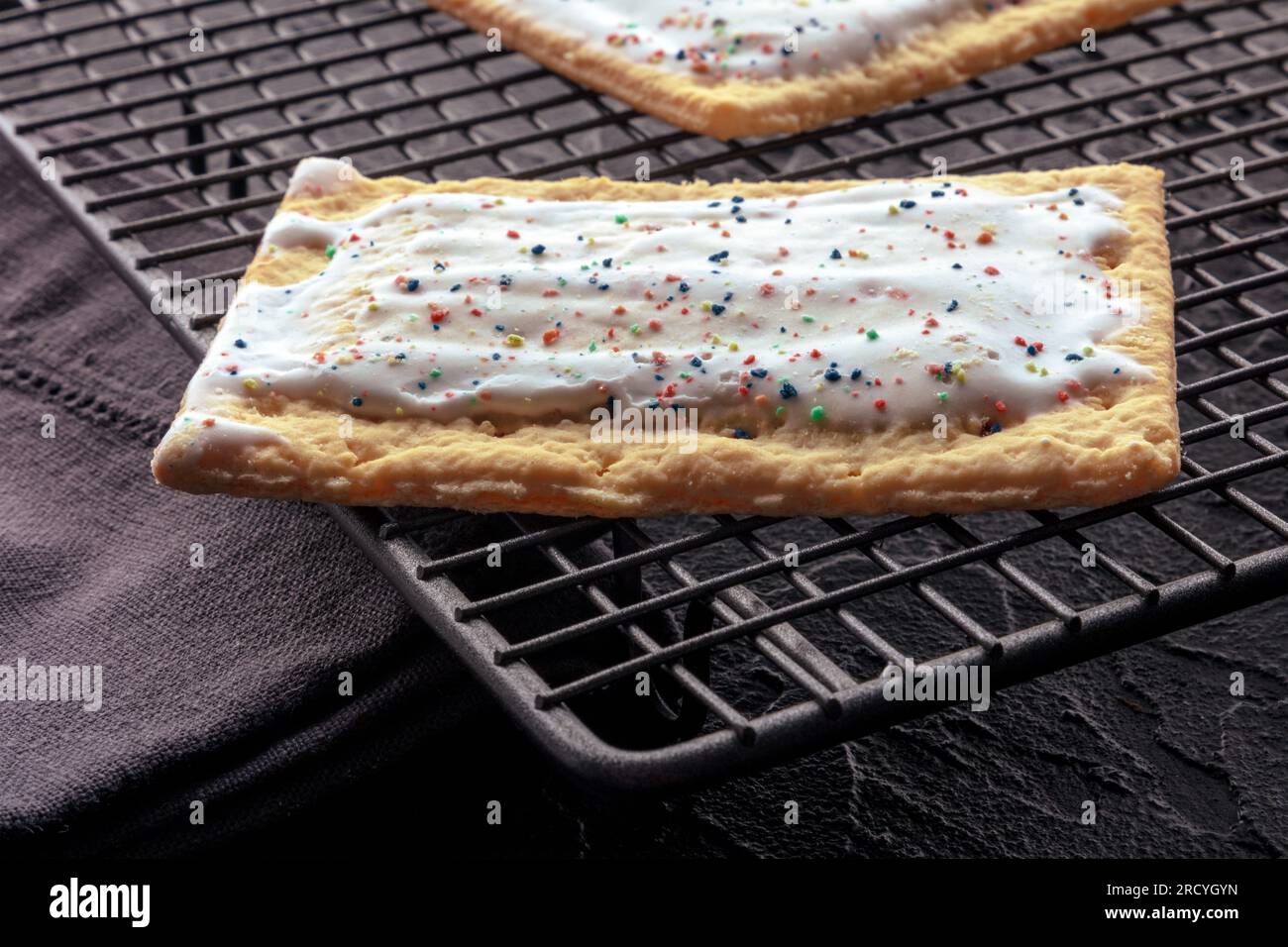 Pop tart on a baking rack. A poptart toaster pastry with icing on a ...