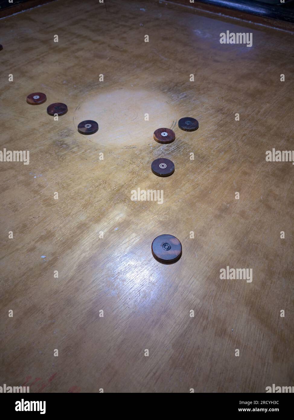 wooden carrom pieces lying on polished board Stock Photo - Alamy